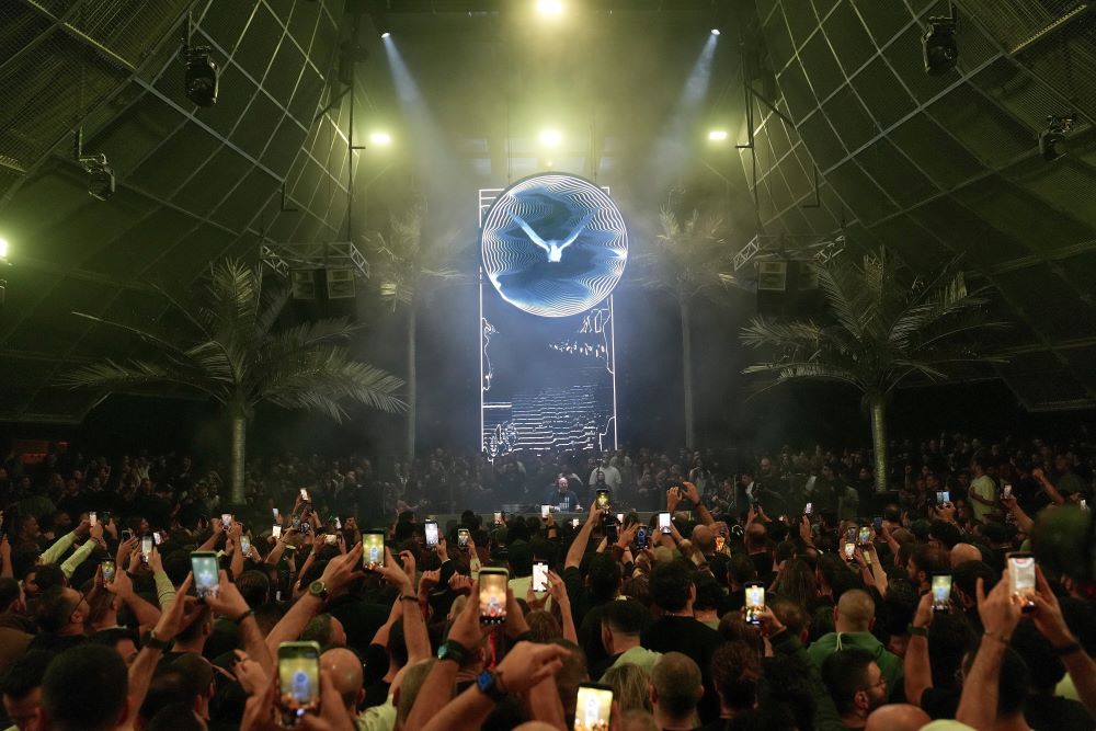 Priest by day, DJ by night: Padre Guilherme's rave in Beirut draws ...